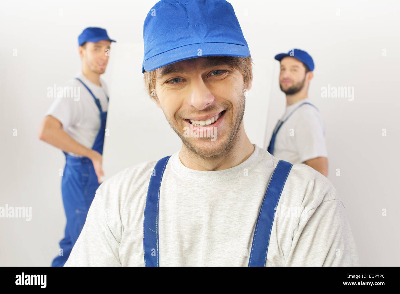 Closeup portrait of three builders Stock Photo - Alamy