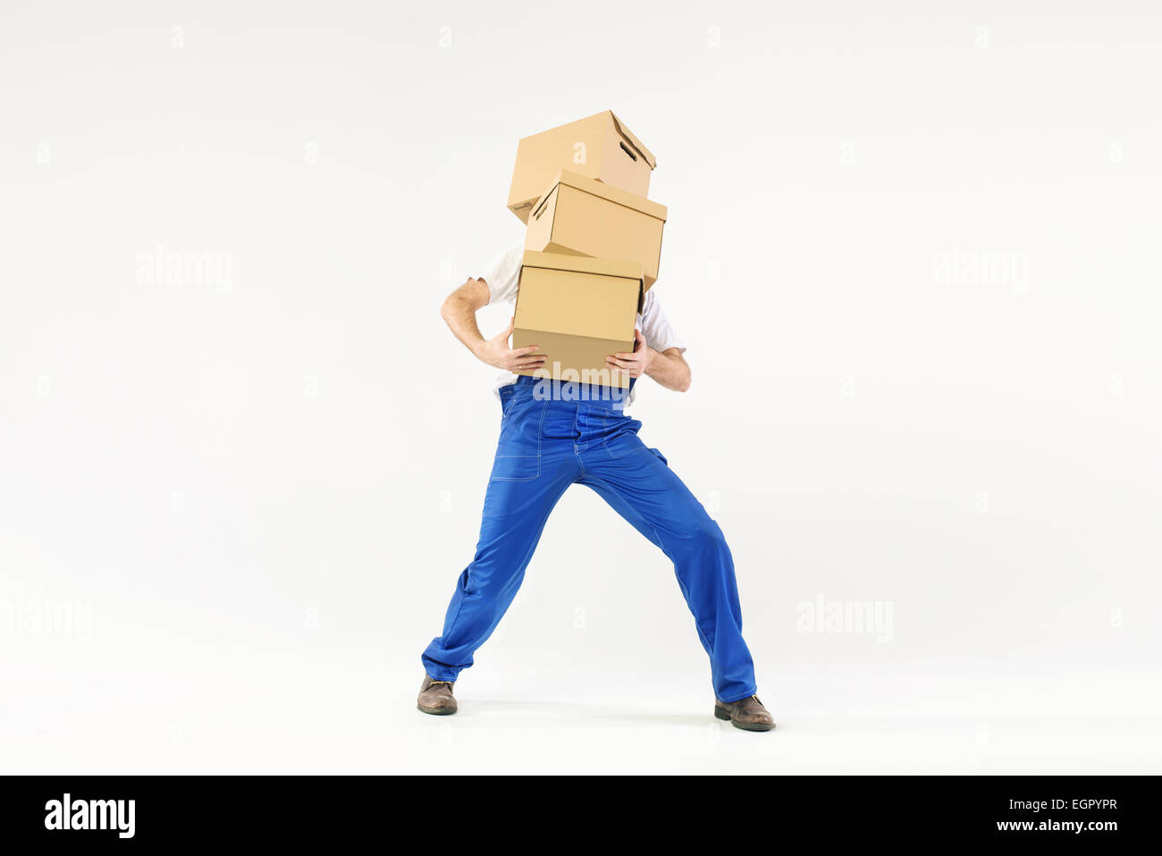 Hard-working engineer with bunch of boxes Stock Photo - Alamy