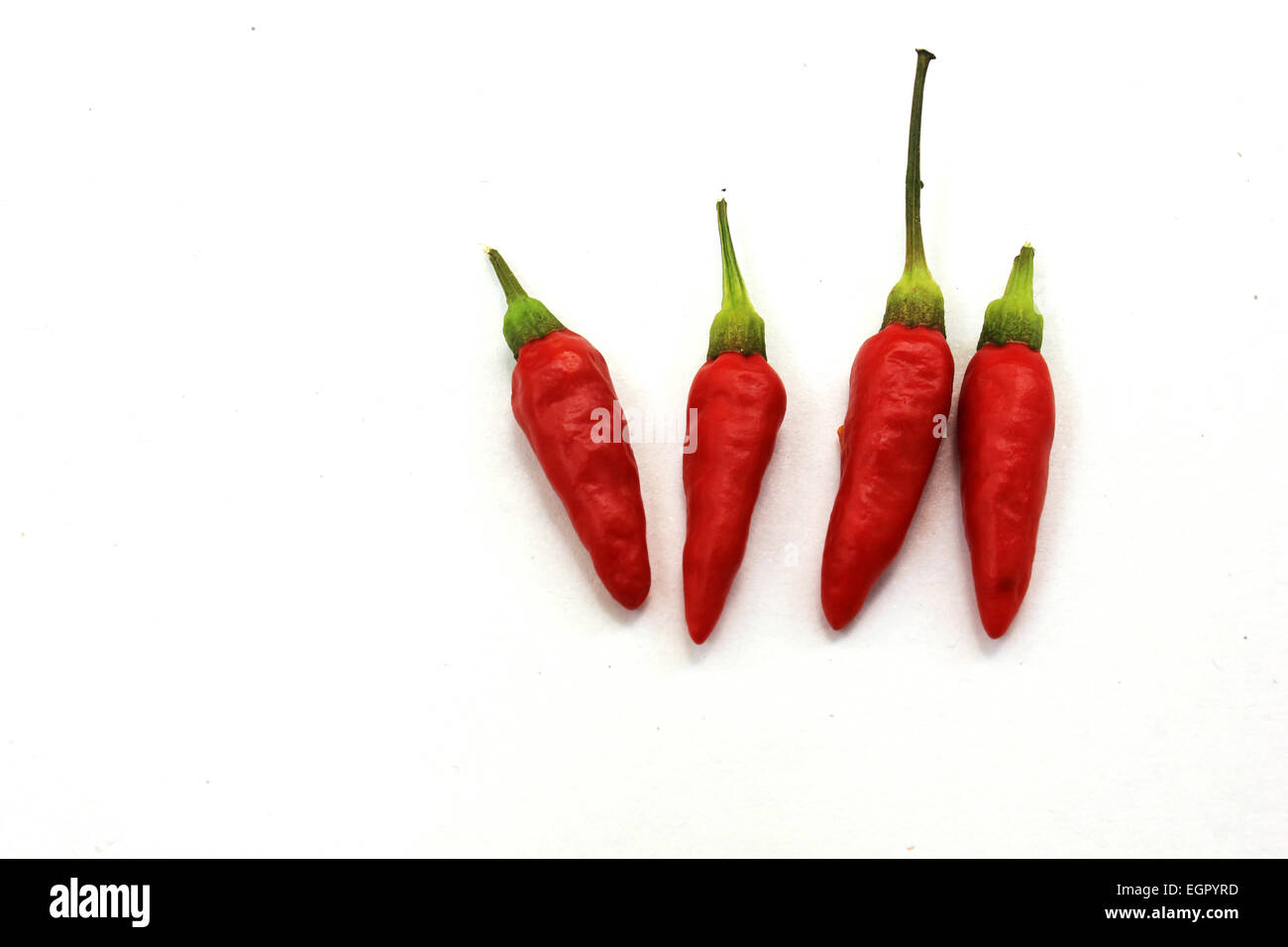 small red hot chillies in white background Stock Photo - Alamy