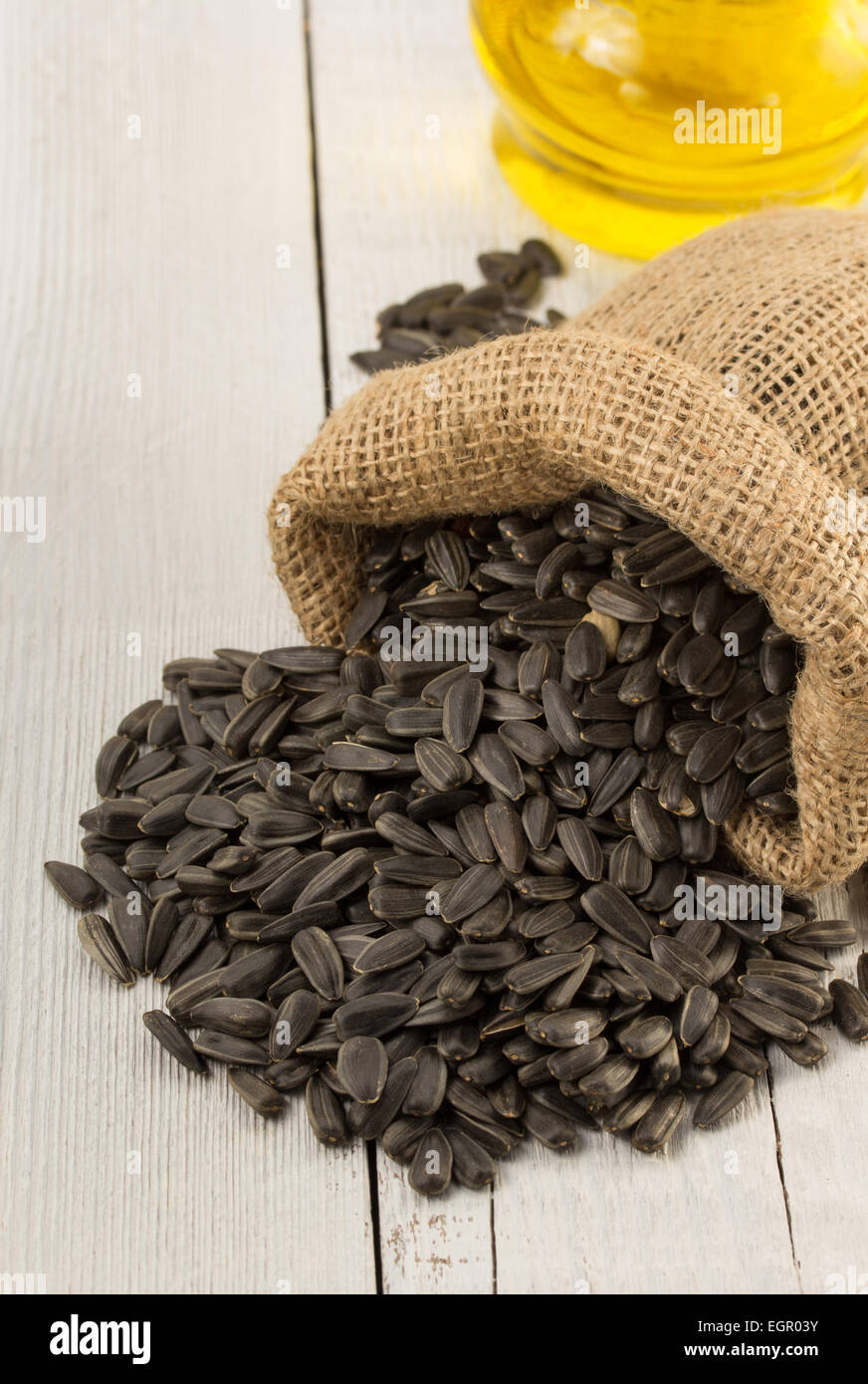 sunflower oil and seeds on wooden background Stock Photo - Alamy