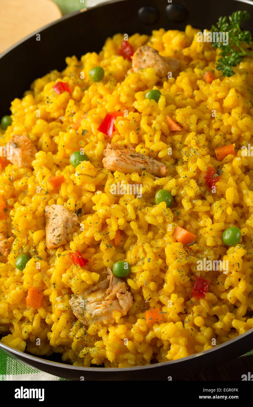 frying pan full of rice on wooden background Stock Photo - Alamy