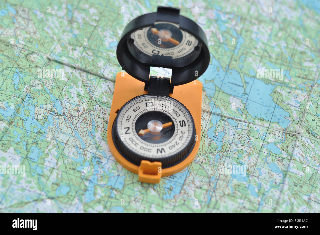 Compass on the map. Magnetic compass in the expanded form is situated ...