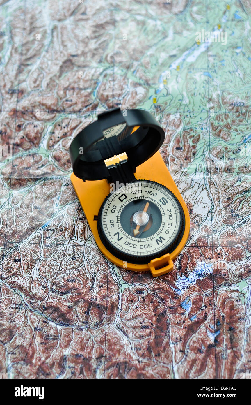 Compass on the map. Magnetic compass in the expanded form is situated ...
