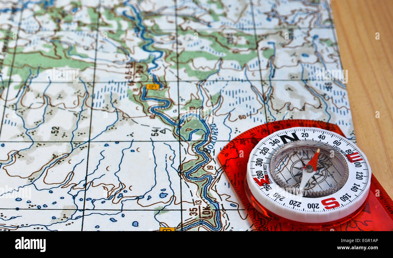 The magnetic compass and topographic map. Travel compass and map ...
