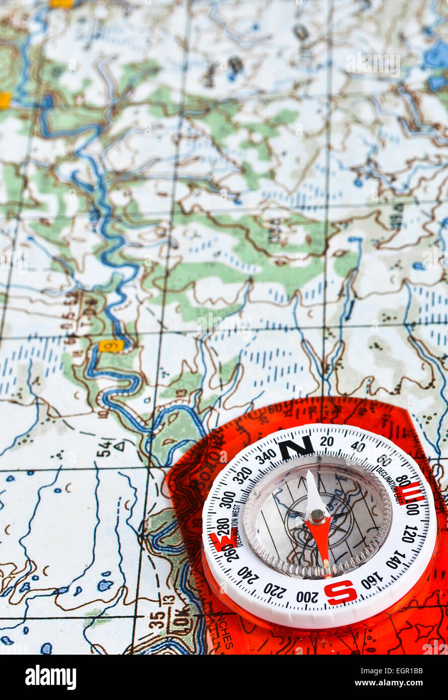 The magnetic compass and topographic map. Travel compass and map ...