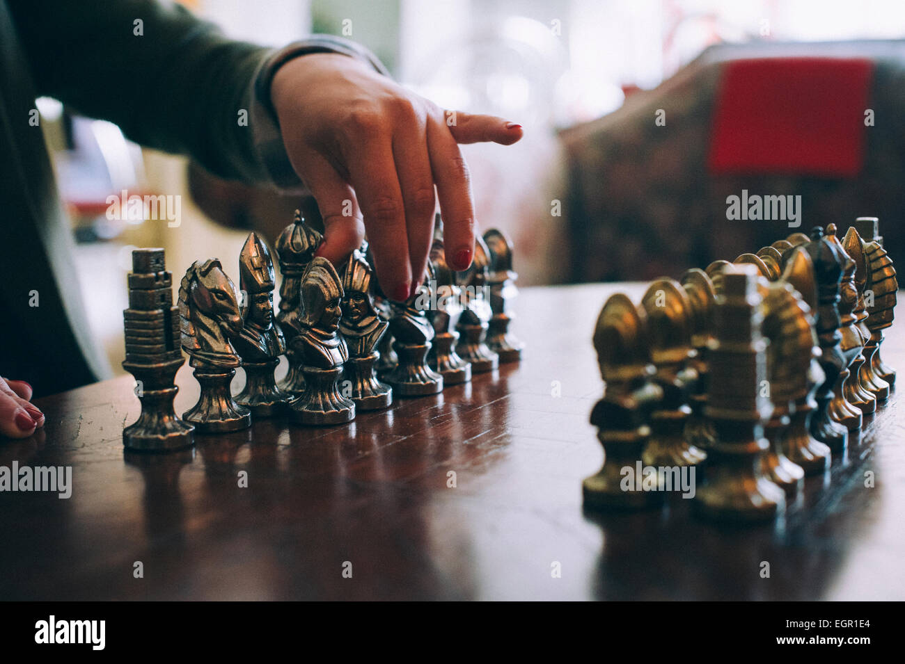 Woman Moving Chess Piece Stock Photo - Alamy