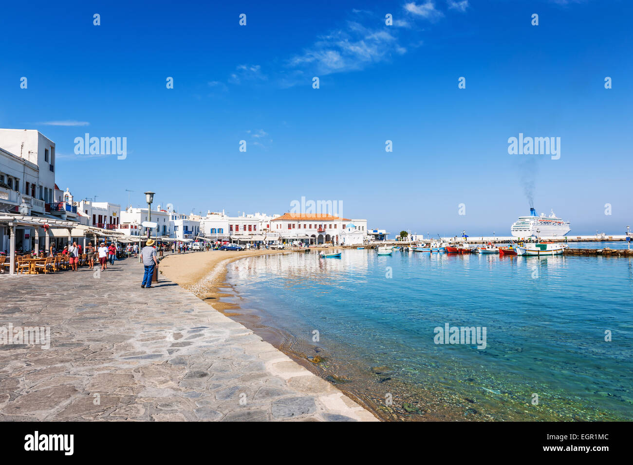 The seaside walkway at the port of Hora on the Greek Island of Mykonos ...