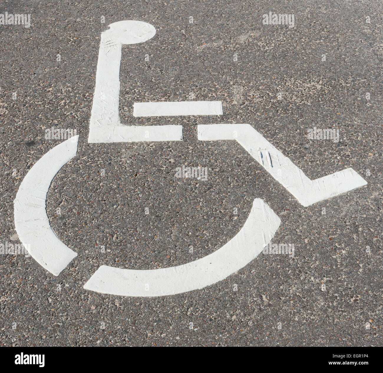 White disabled sign on car park Stock Photo - Alamy
