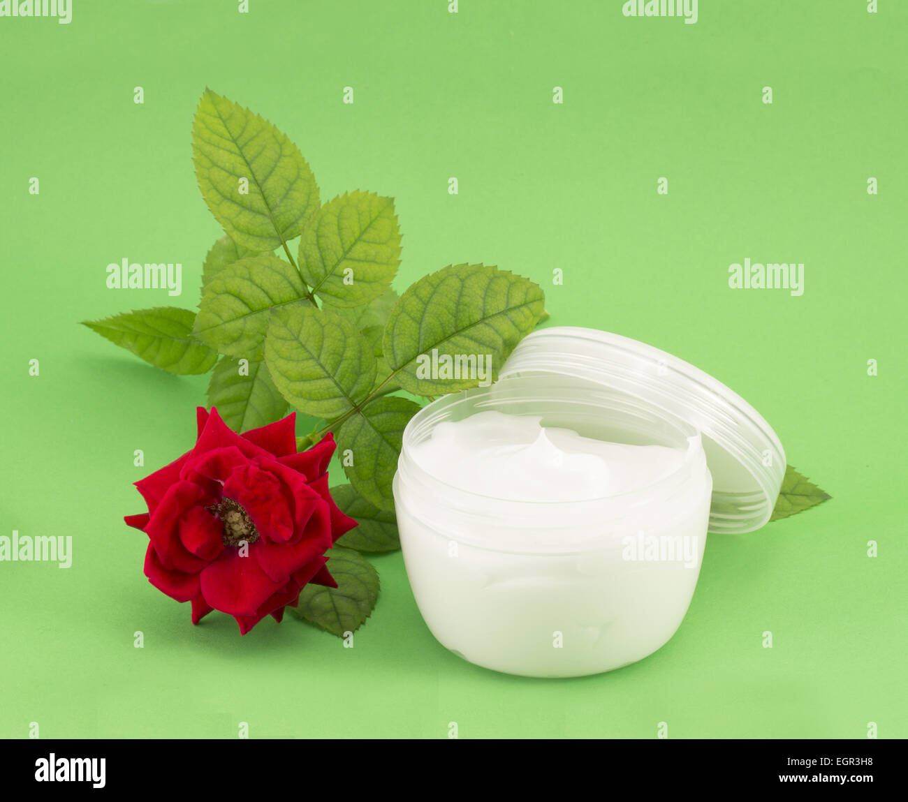 tube of cream, white and cream roses Stock Photo - Alamy