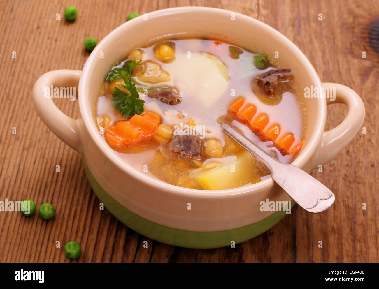 Yellow pea soup, stew meat and potato, horizontal Stock Photo - Alamy