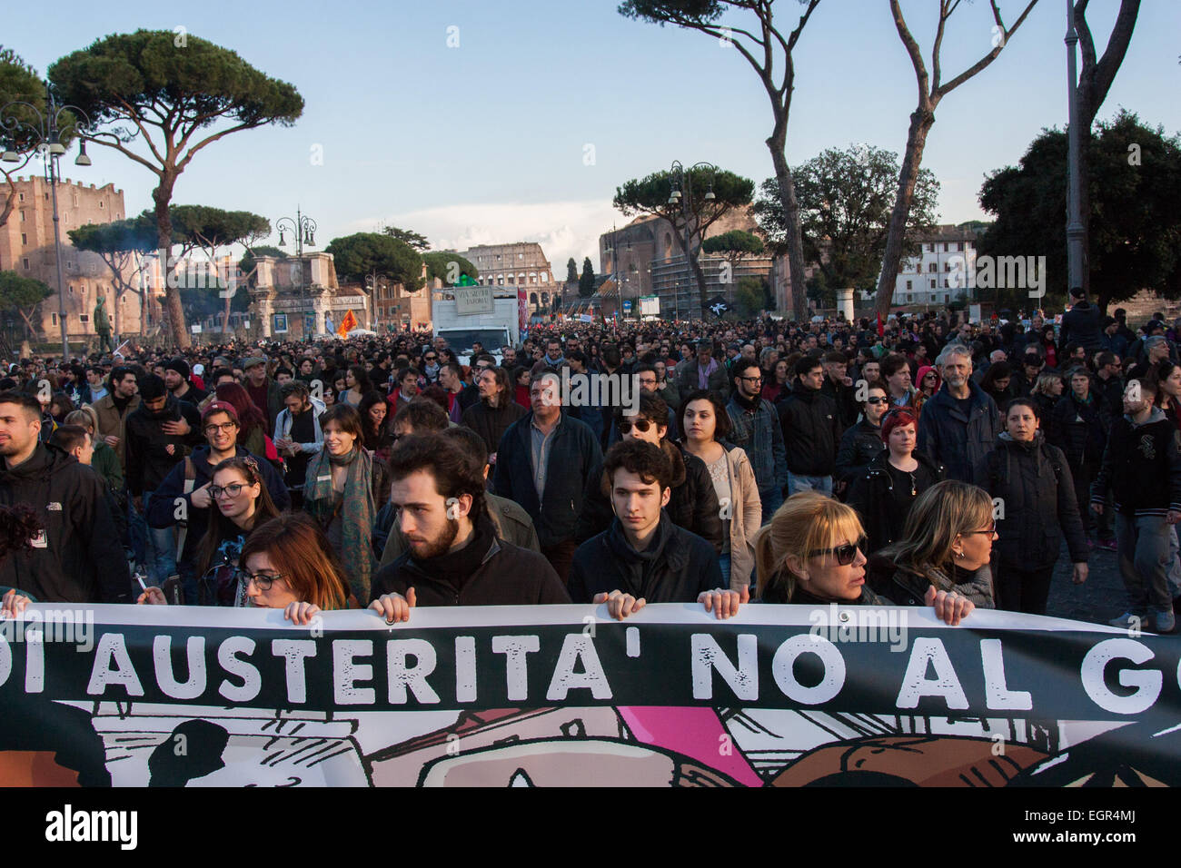 Demonstrators hold up a banner reading in Italian "No to austerity ...