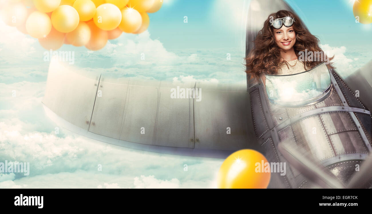 Fantasy. Happy Woman in Cockpit of Aircraft Having Fun Stock Photo - Alamy
