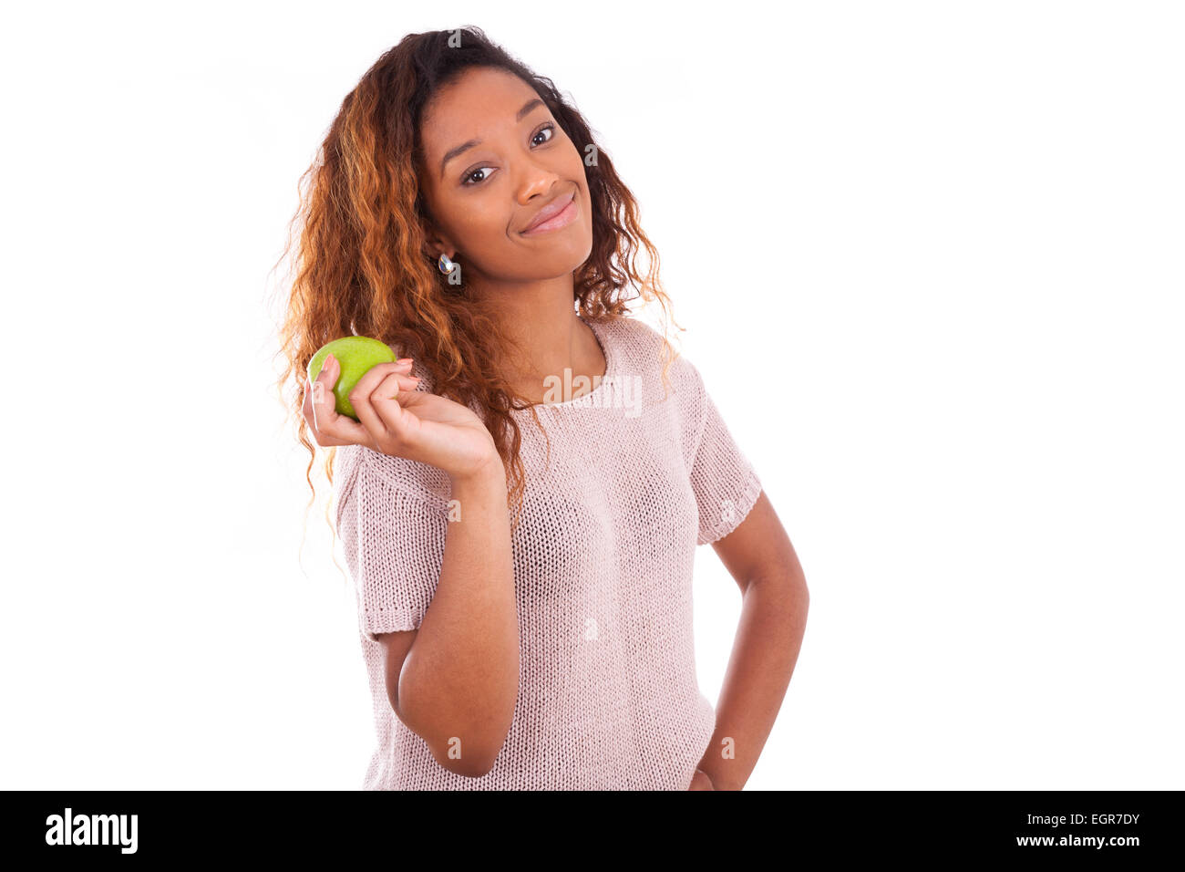 African American young woman holding one green apple Stock Photo - Alamy