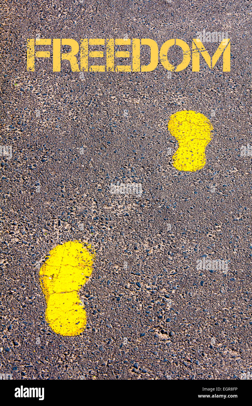 Yellow footsteps on sidewalk towards Freedom message, Independence ...