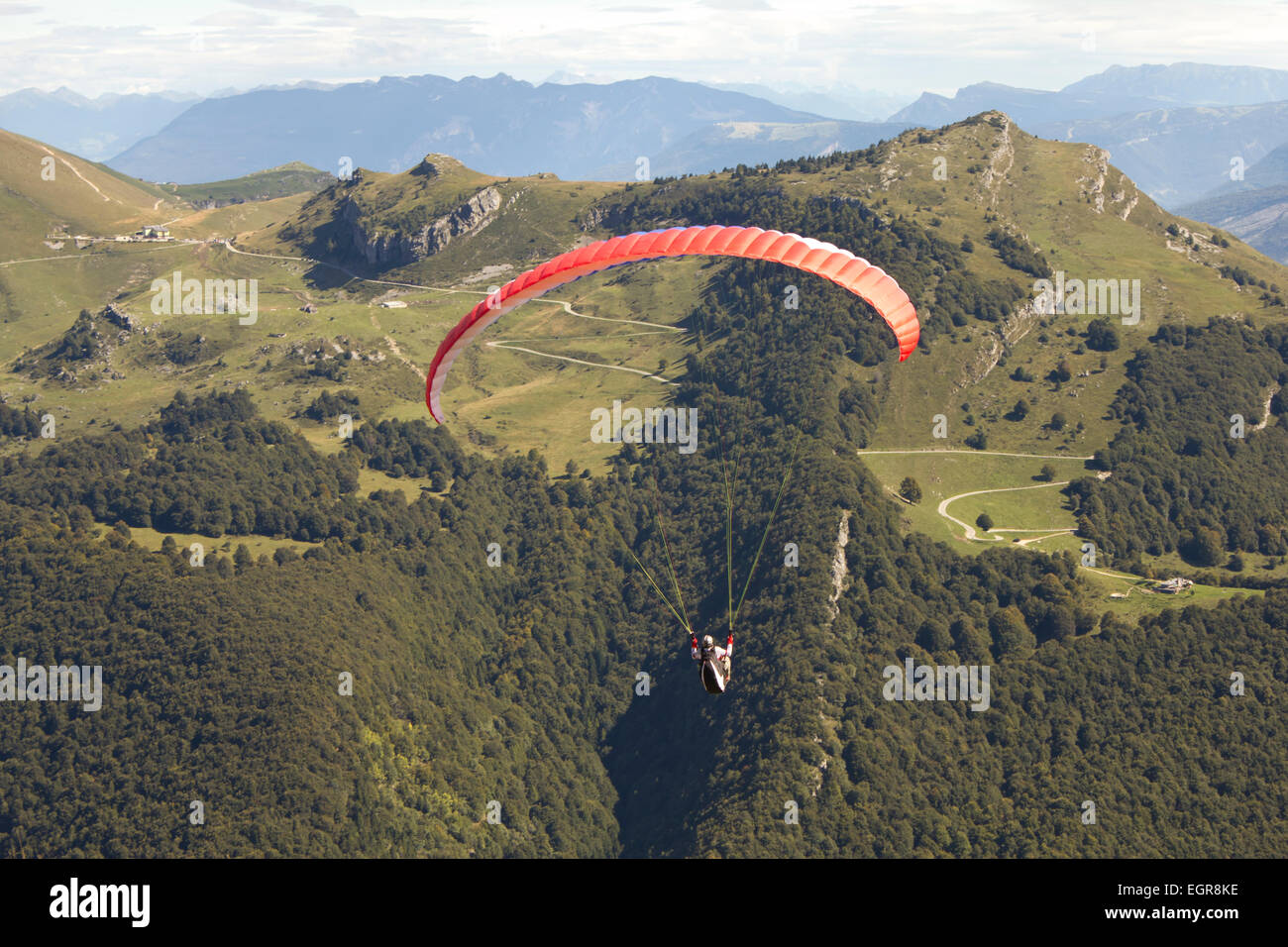 Paragliding / hang gliding in the mountains, in the Italian Alps, on ...