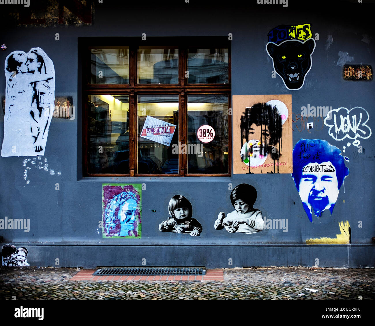 Berlin street art faces, urban art decorates exterior of restaurant in ...