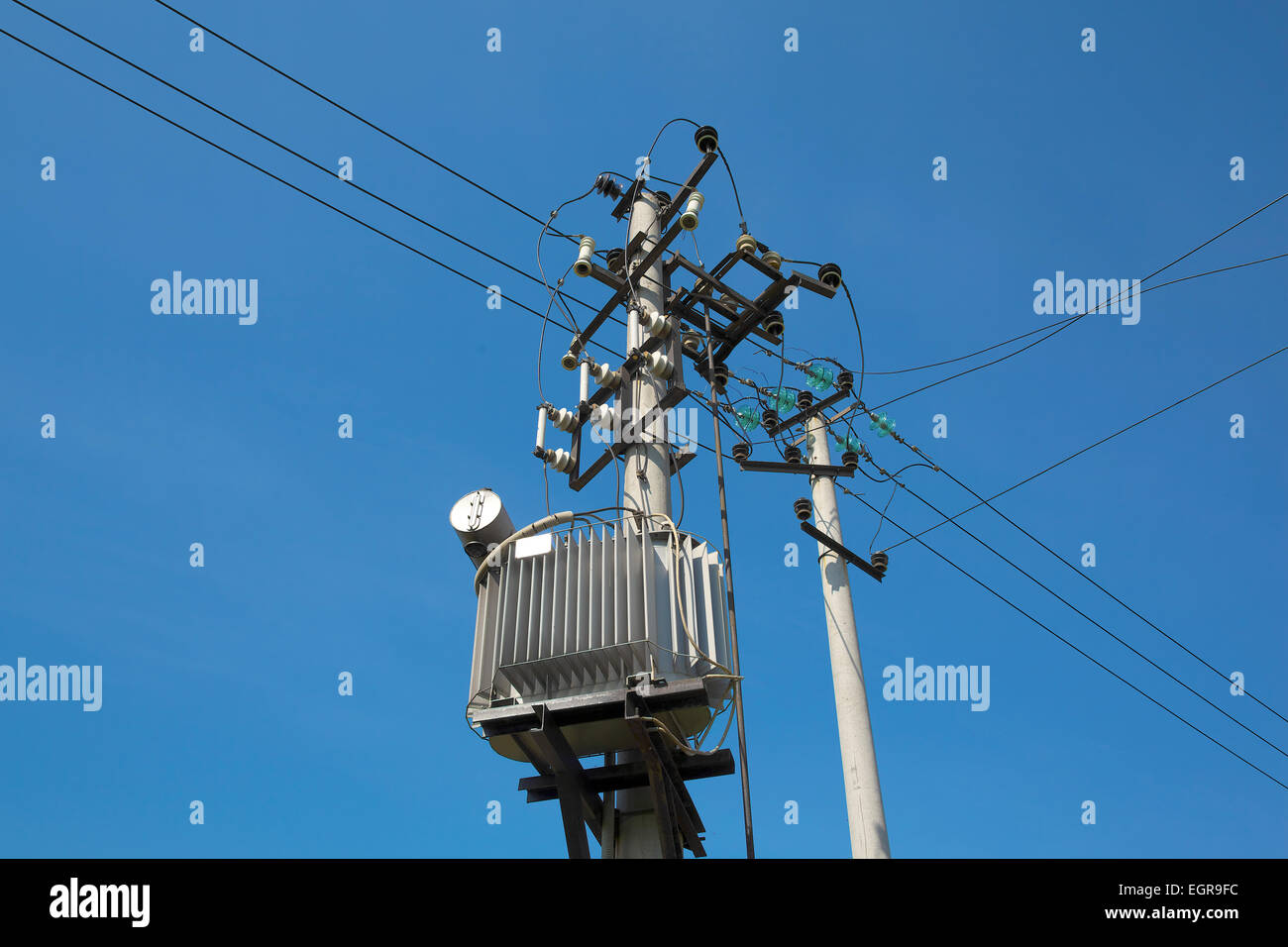 Pylons with electric wires and distribution transformer Stock Photo - Alamy