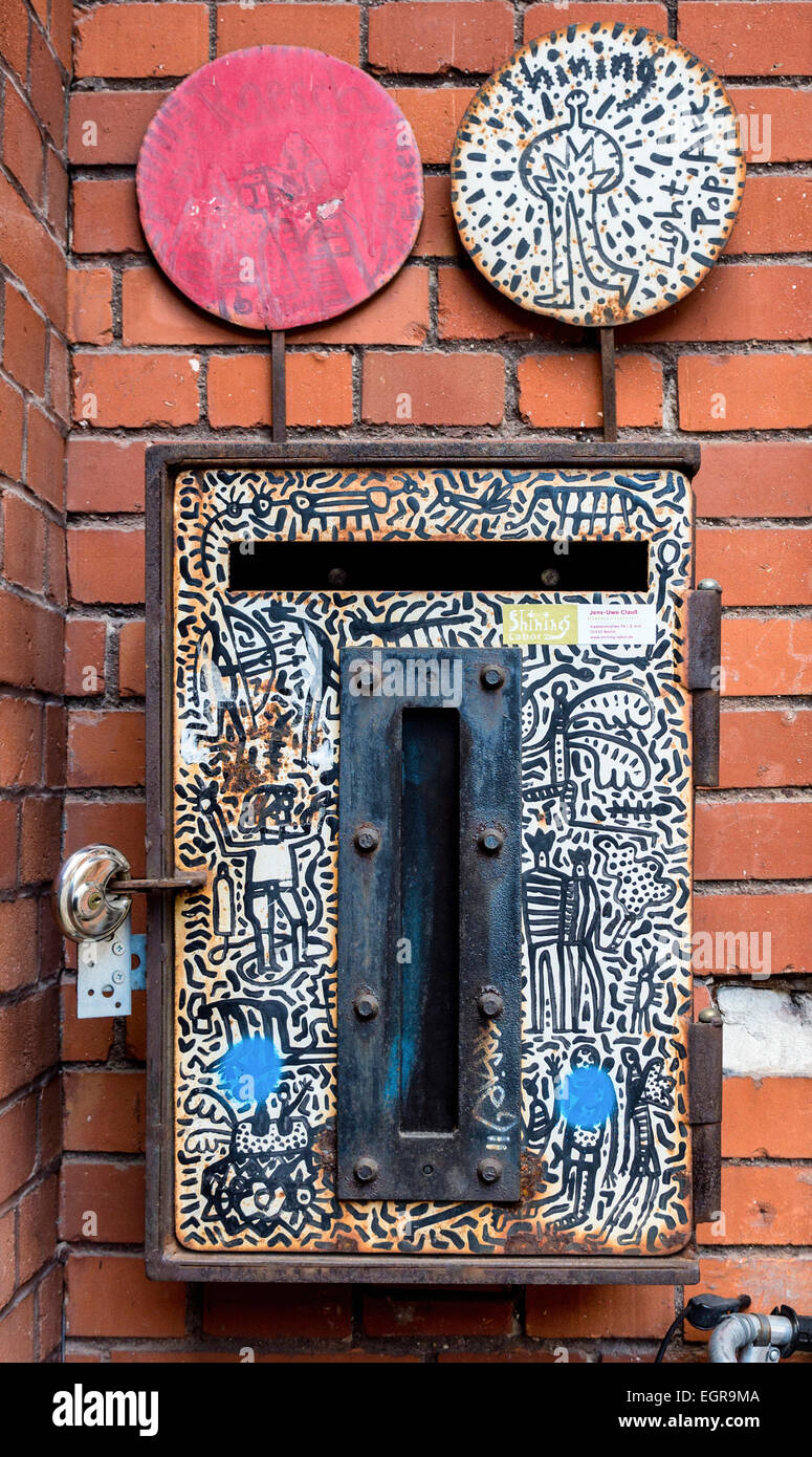 Berlin Dock 11 Detail of postbox and urban street art, old building now ...