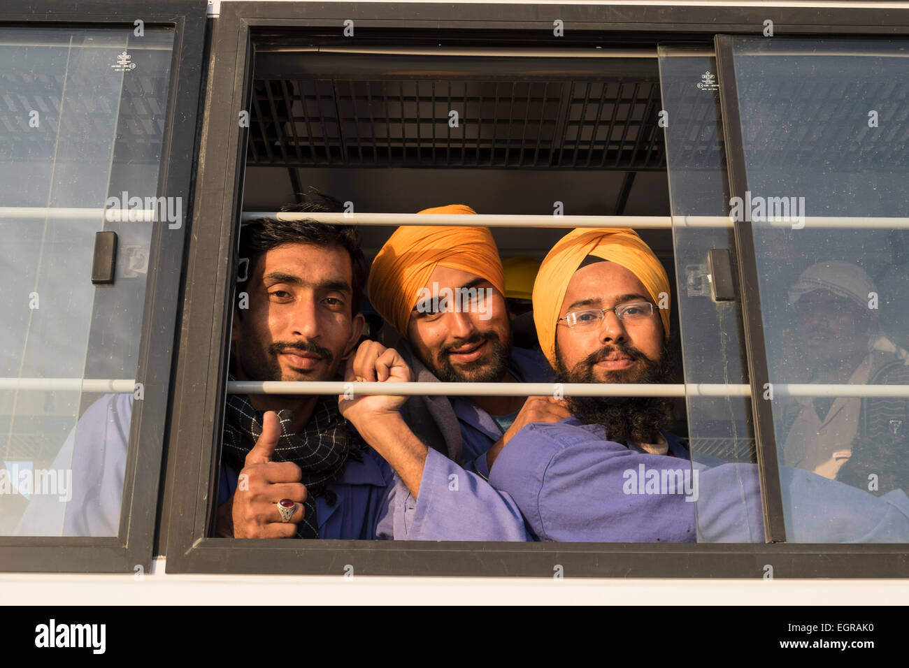 Construction workers on bus at end of working day in Dubai United Arab ...