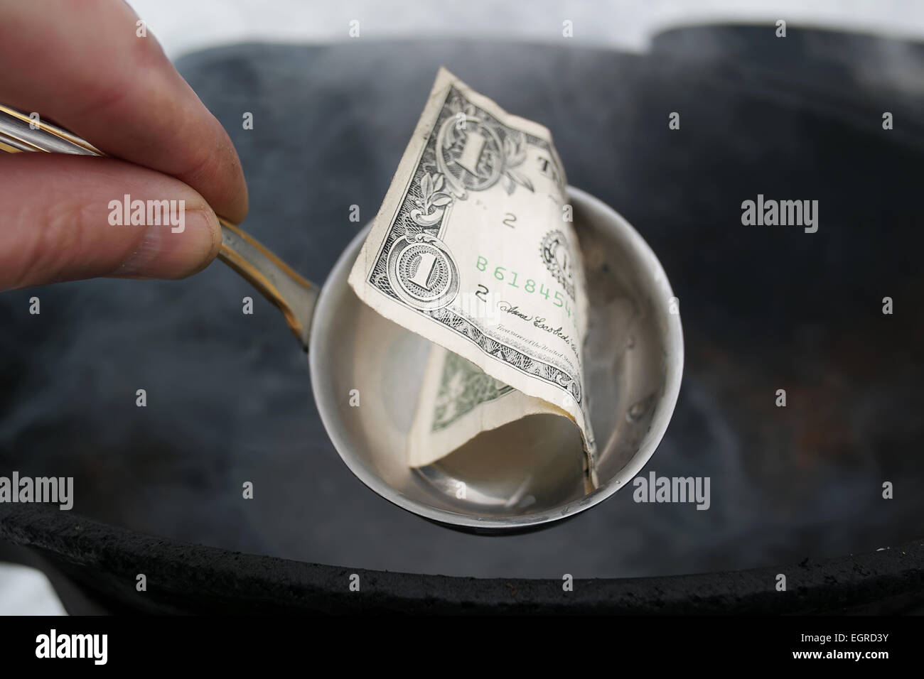 Hand holding ladle hi-res stock photography and images - Alamy