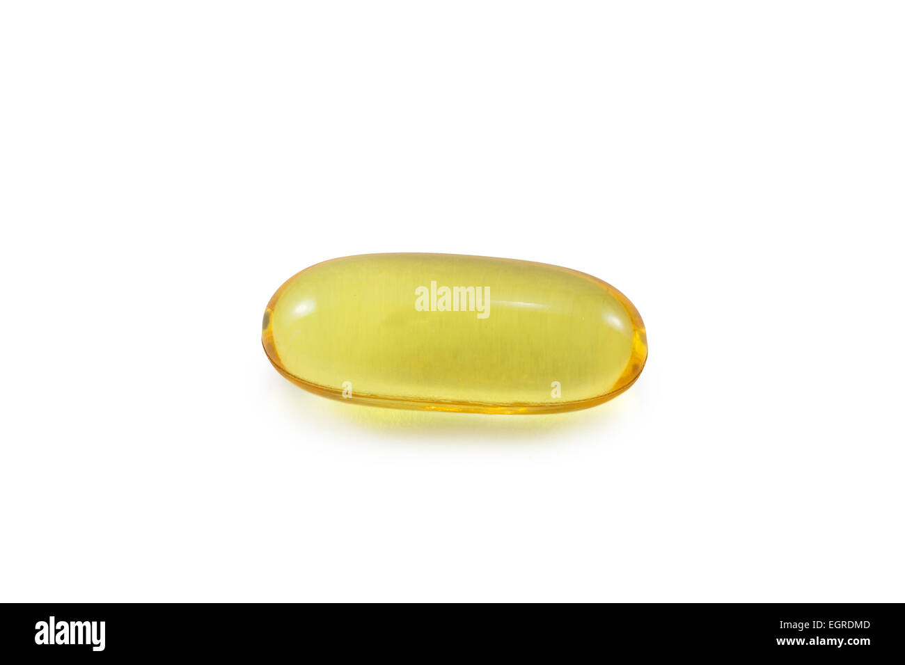 yellow pills close-up on white background Stock Photo - Alamy