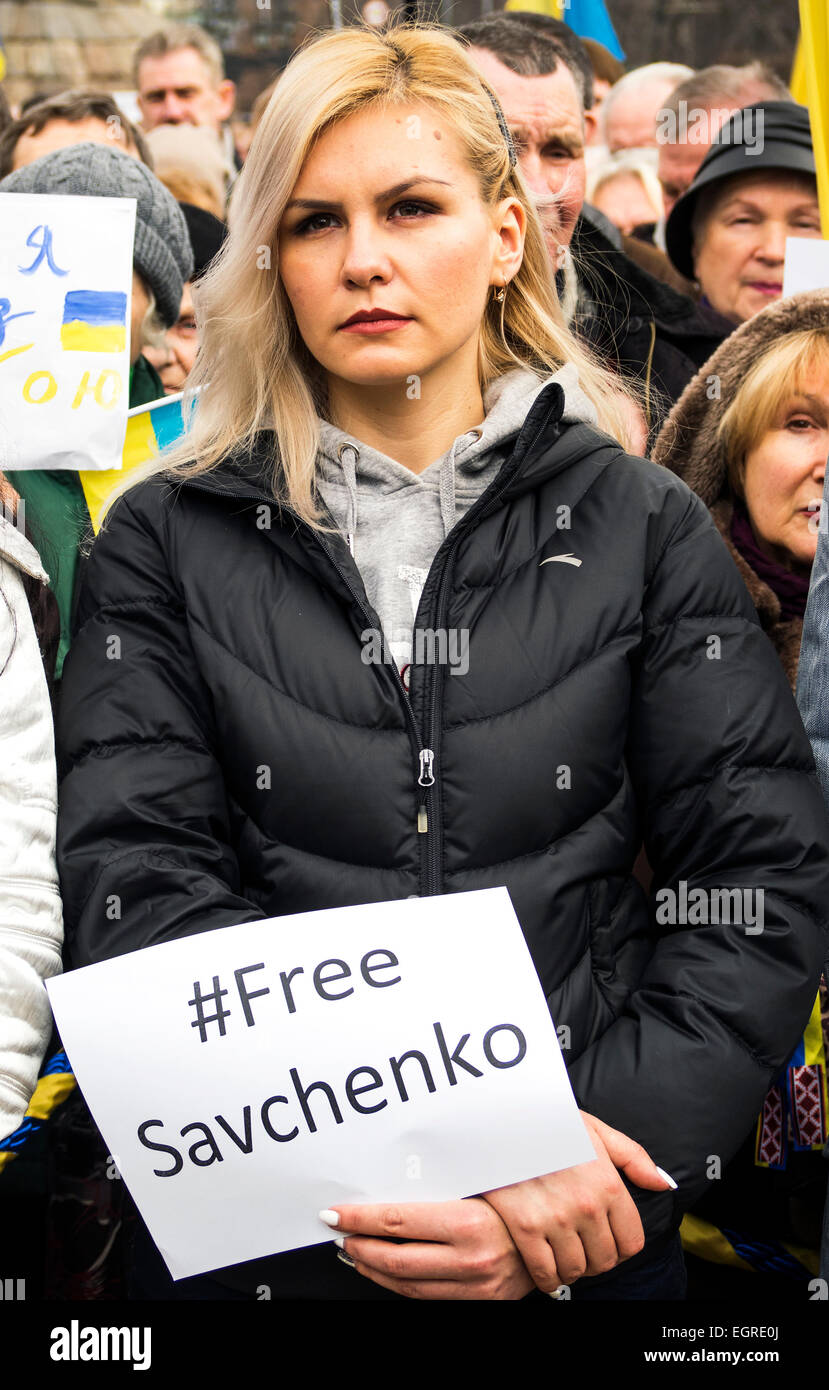 Kiev, Ukraine 1st March 2015. A woman is holding a homemade banner with ...