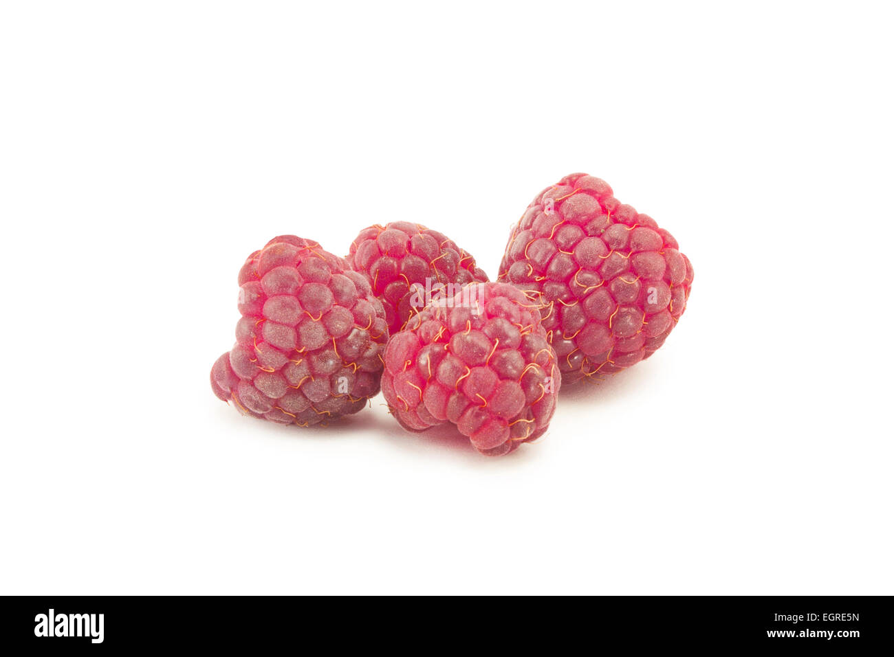 red, ripe raspberries on a white background Stock Photo - Alamy