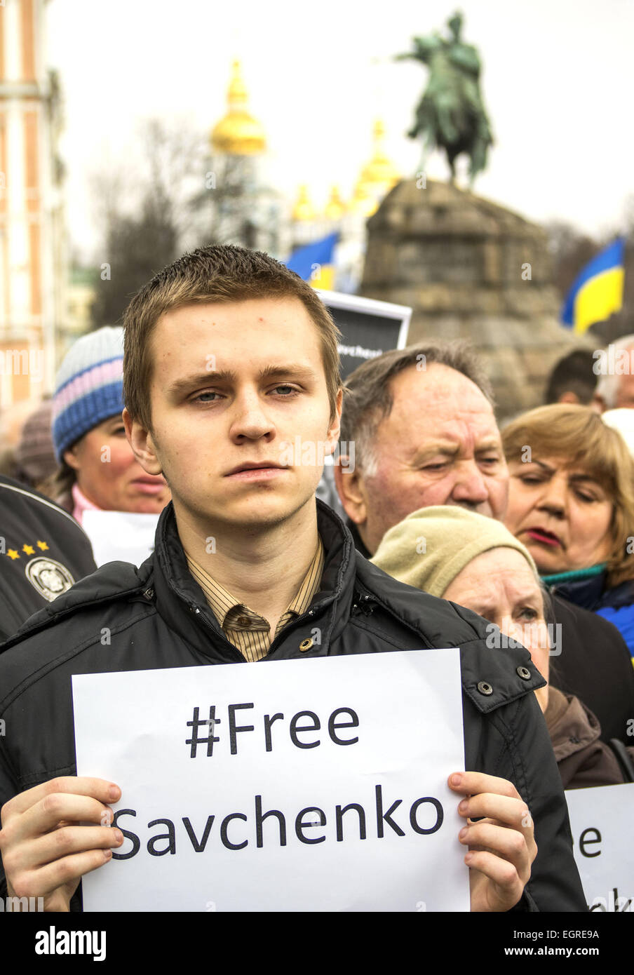 March 1, 2015 - A young man is holding a homemade banner with the ...