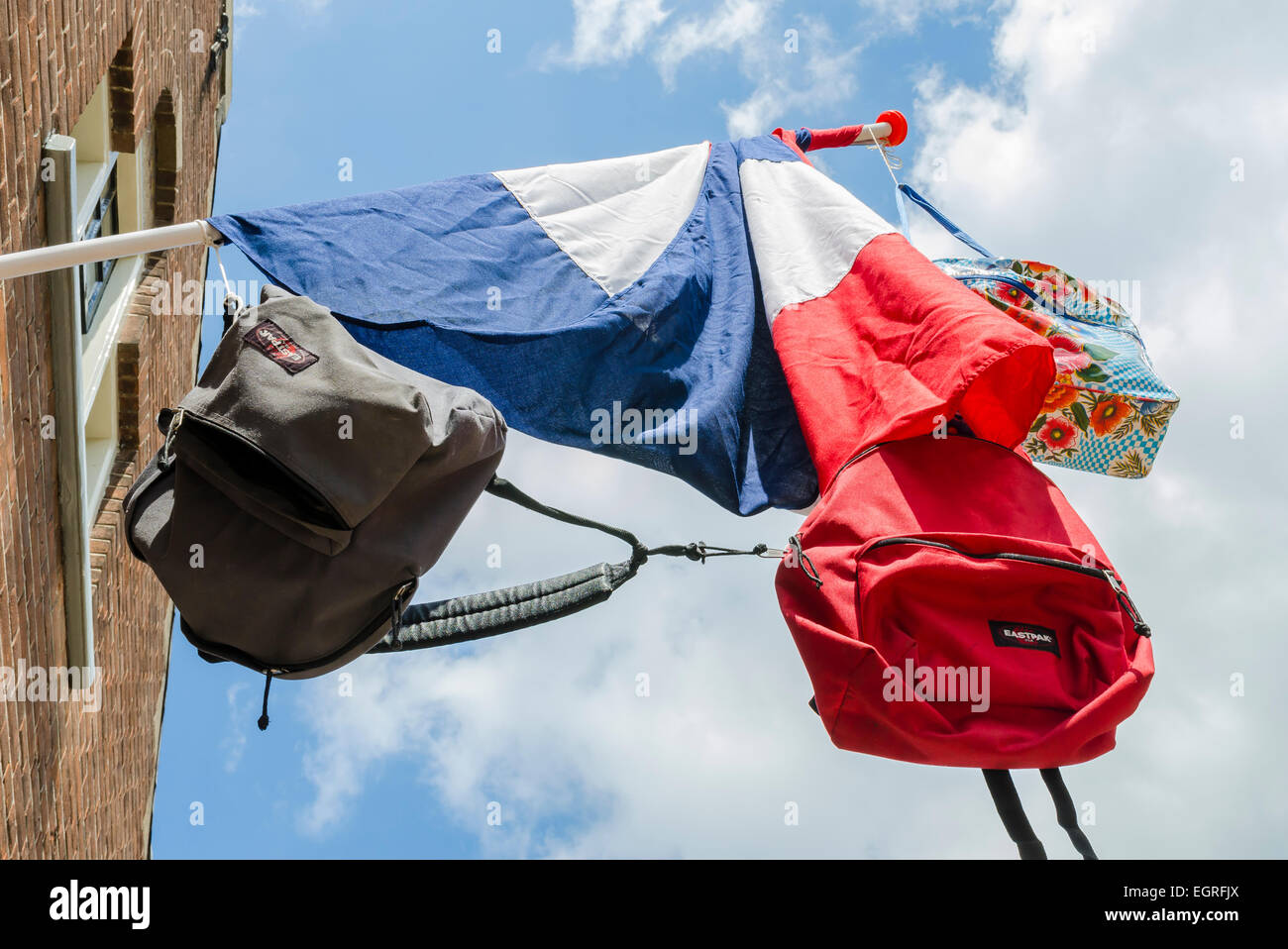 Dutch flag with three bags hanging on it in the town of Wijk bij ...