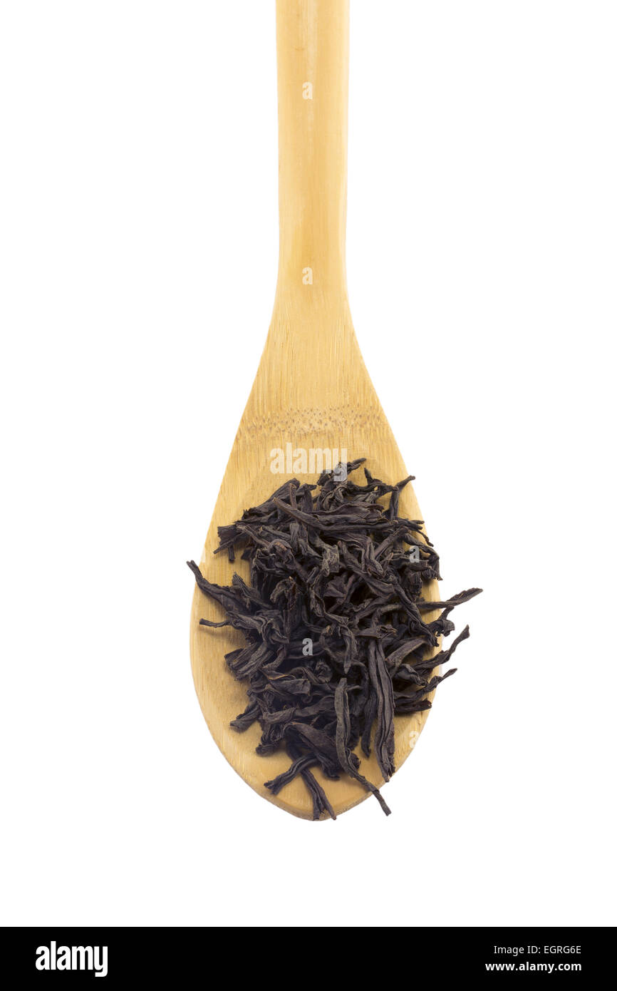 wooden spoon black Tea isolated on a white background Stock Photo - Alamy