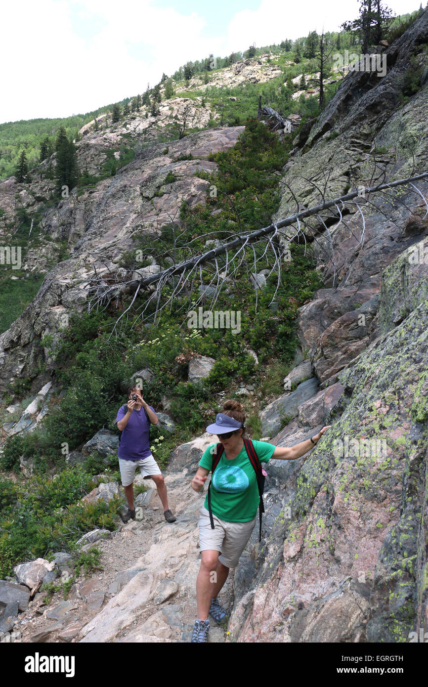 Hikers on mountain cliff trail Colorado Stock Photo - Alamy