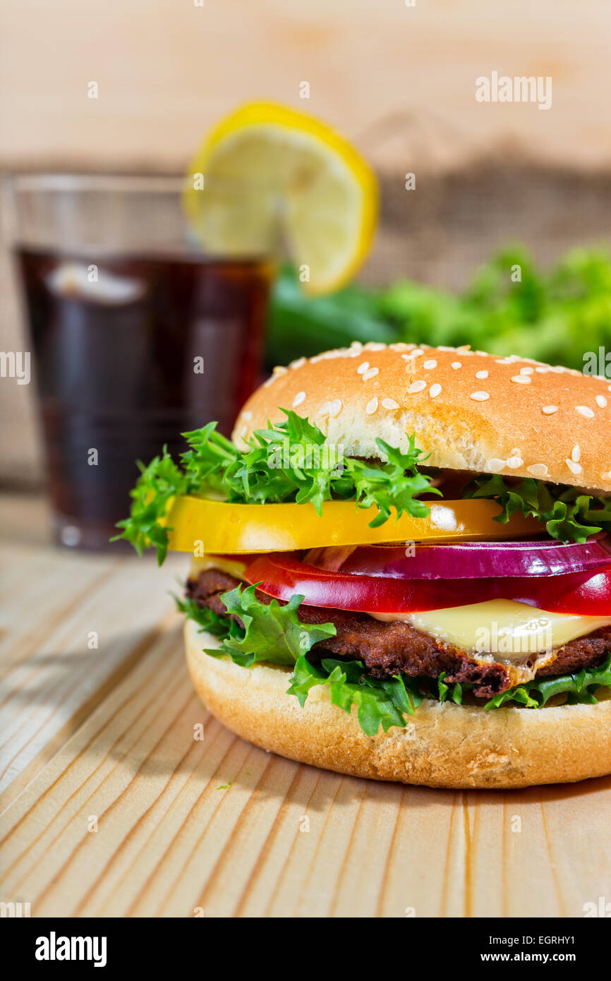 hamburger and drink with slice of lemon Stock Photo - Alamy