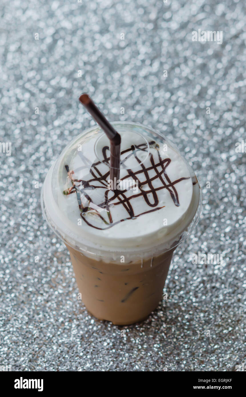 Iced coffee with straw in plastic cup for take aways Stock Photo - Alamy