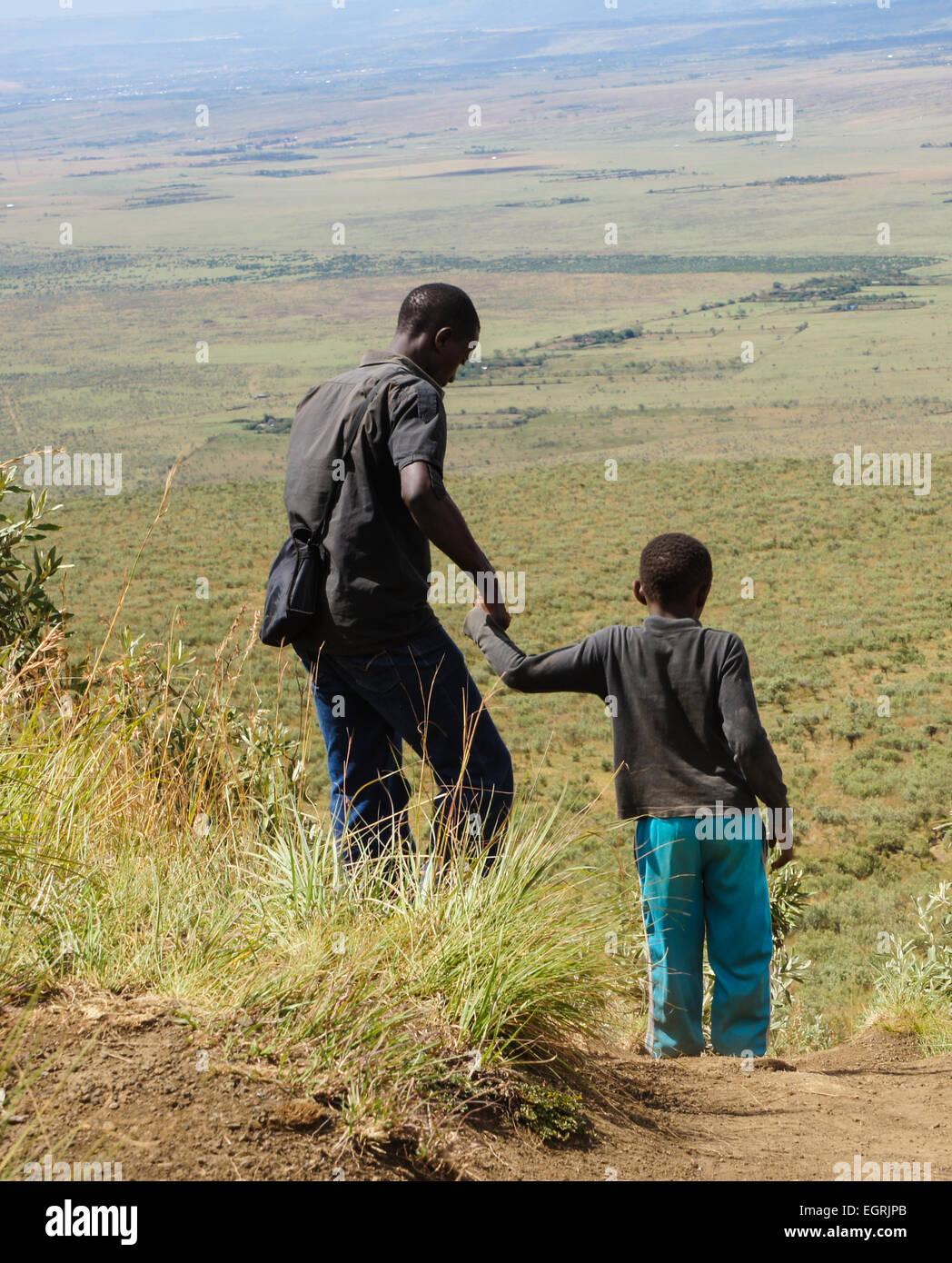 A father and child taking a hike, Mount Longonot, great rift valley ...