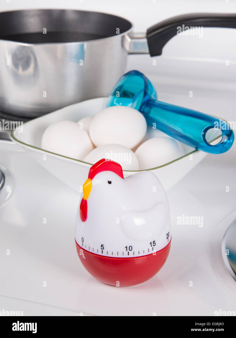 Kitchen tools for boiling eggs on stove Stock Photo - Alamy