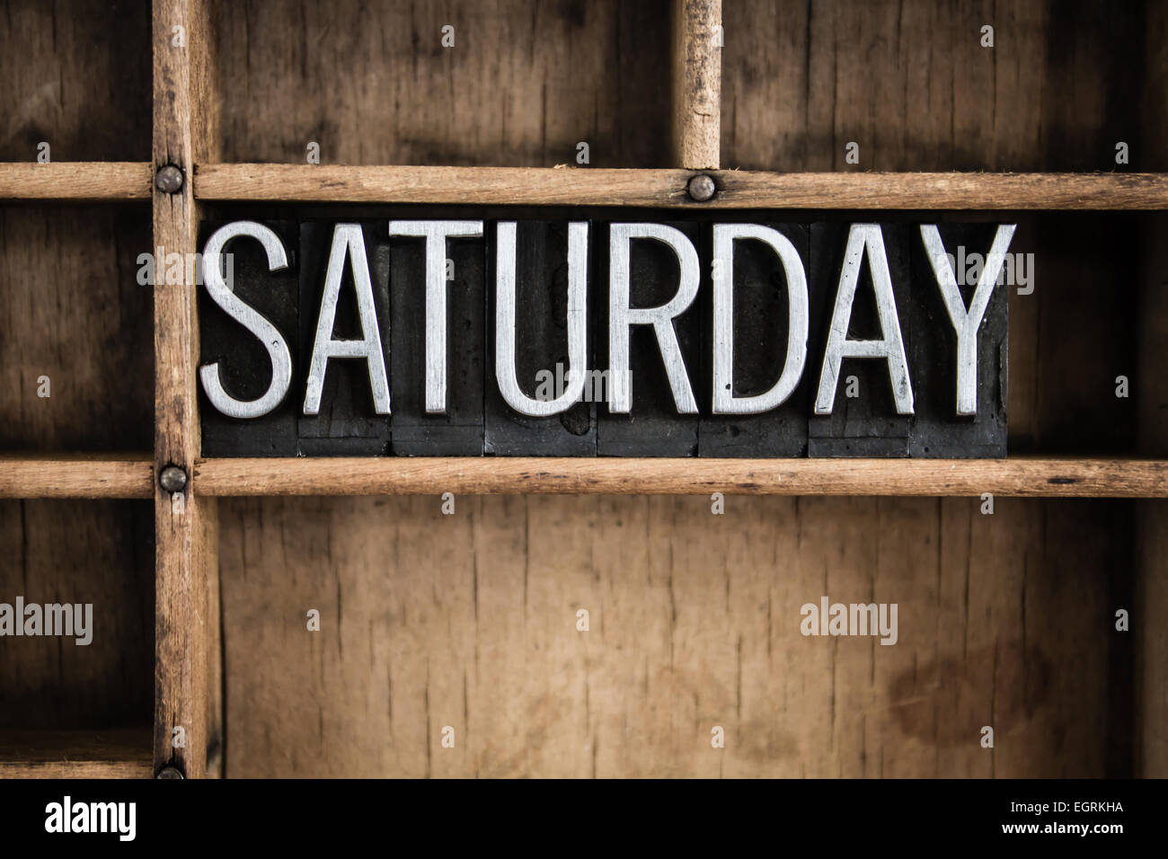 The word "SATURDAY" written in vintage metal letterpress type in a ...