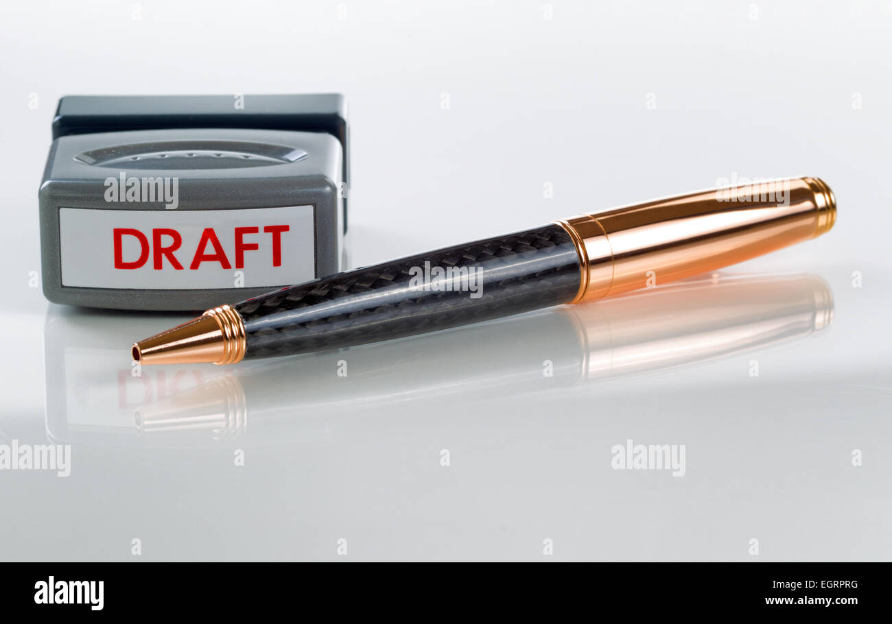 Elegant business pen and draft stamp, focus on part of pen front and ...