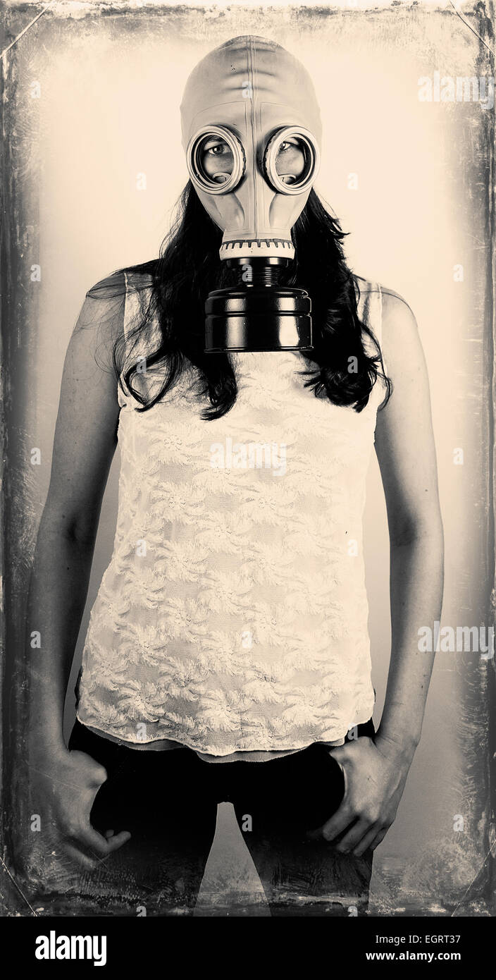 Woman wearing gas mask looking straight into camera Stock Photo - Alamy