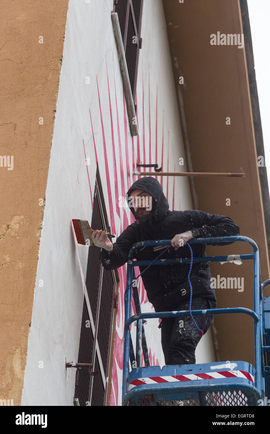 Domenico Romeo painting a mural for Big City Life is a project of ...