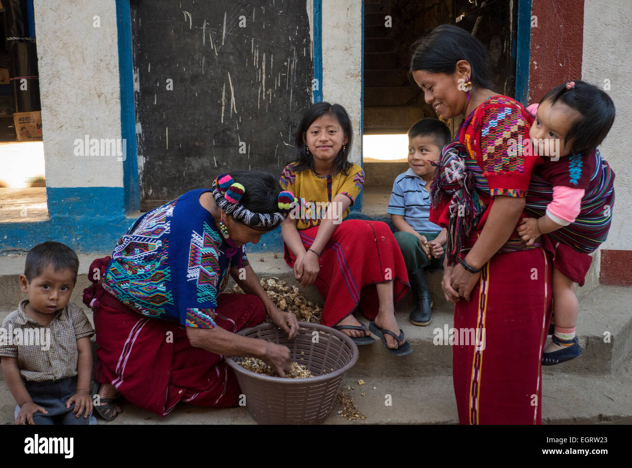 Indigenous women with their children outside their houses in Santa ...
