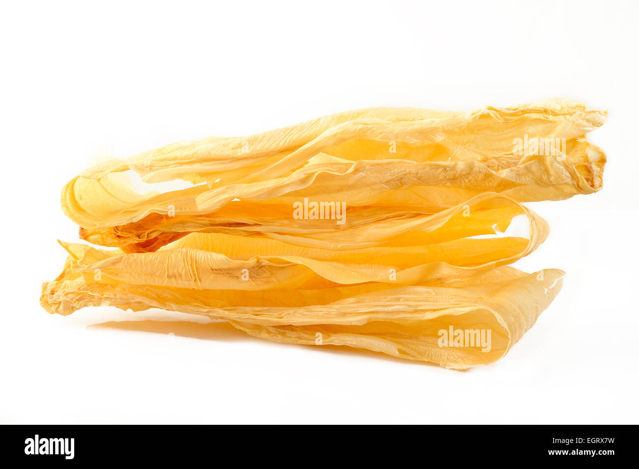 Dried tofu skin on white background Stock Photo - Alamy