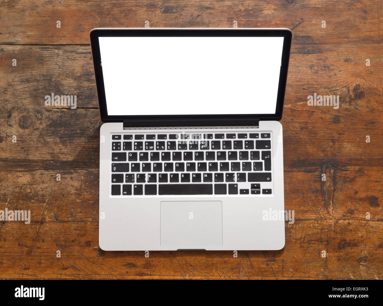 Open laptop with isolated white screen on old wooden desk Stock Photo ...