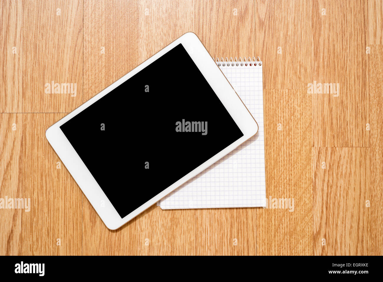 Digital tablet on wooden tablets with notepad and pen Stock Photo - Alamy