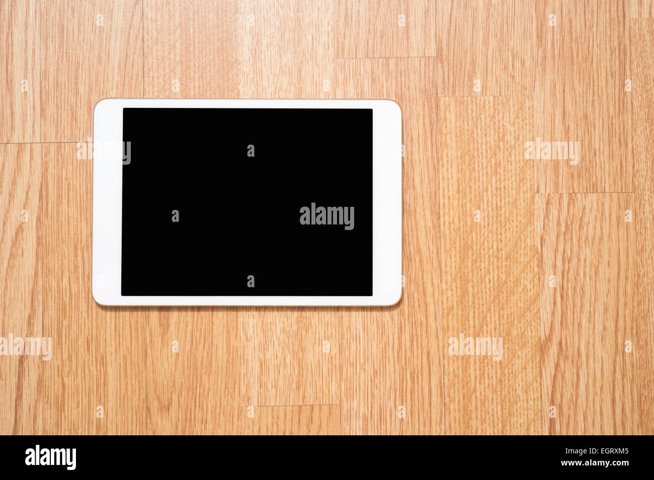 Digital tablet on wooden tablets Stock Photo - Alamy