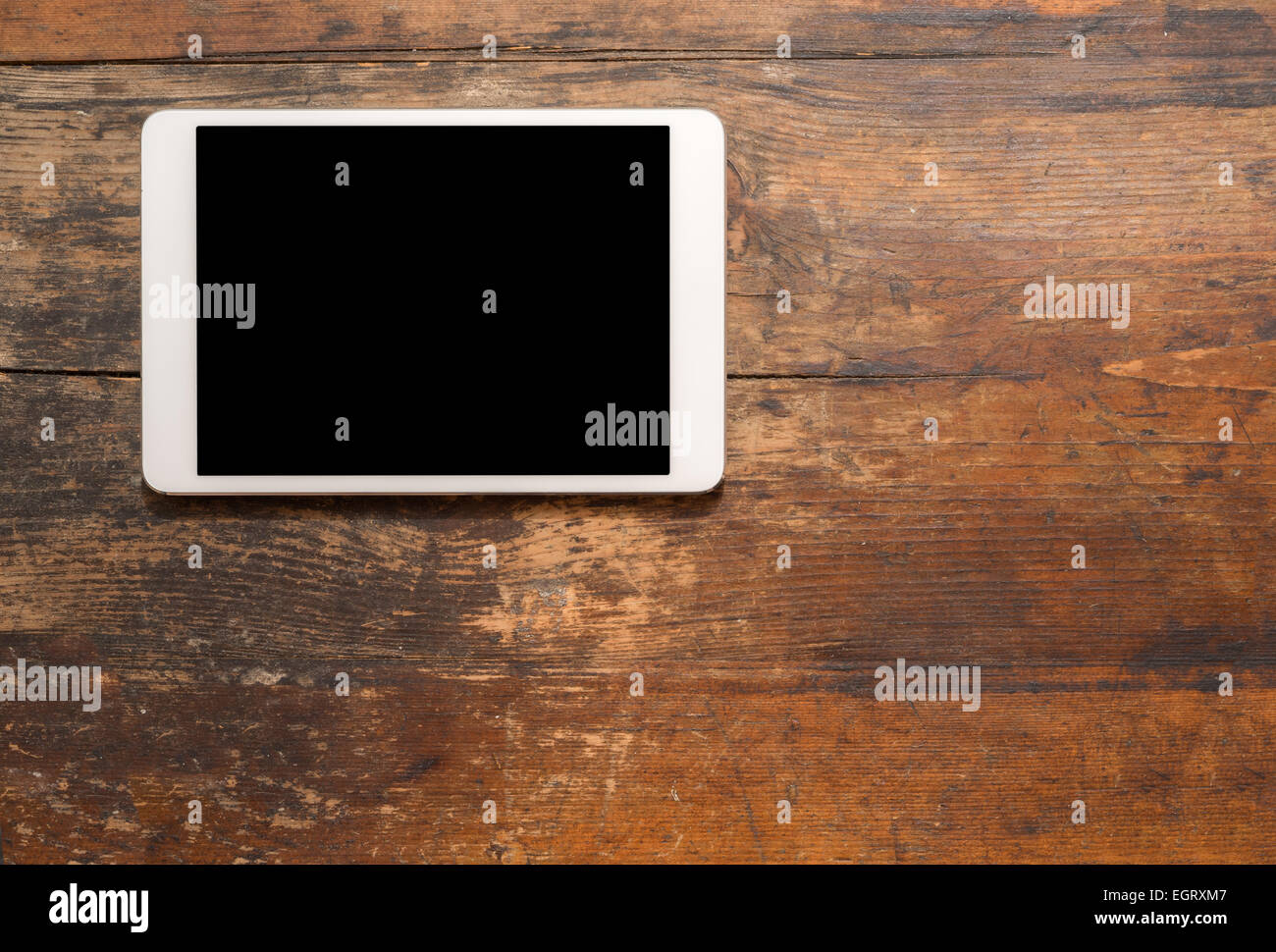 Digital tablet on wooden tablets Stock Photo - Alamy