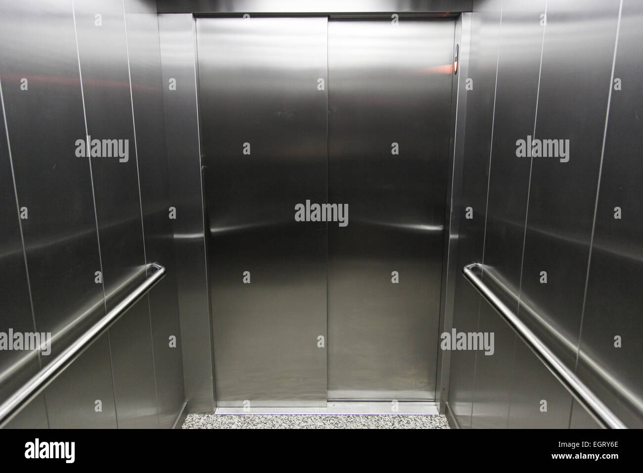 Interior of a metal elevator, detail of a modern stainless steel ...