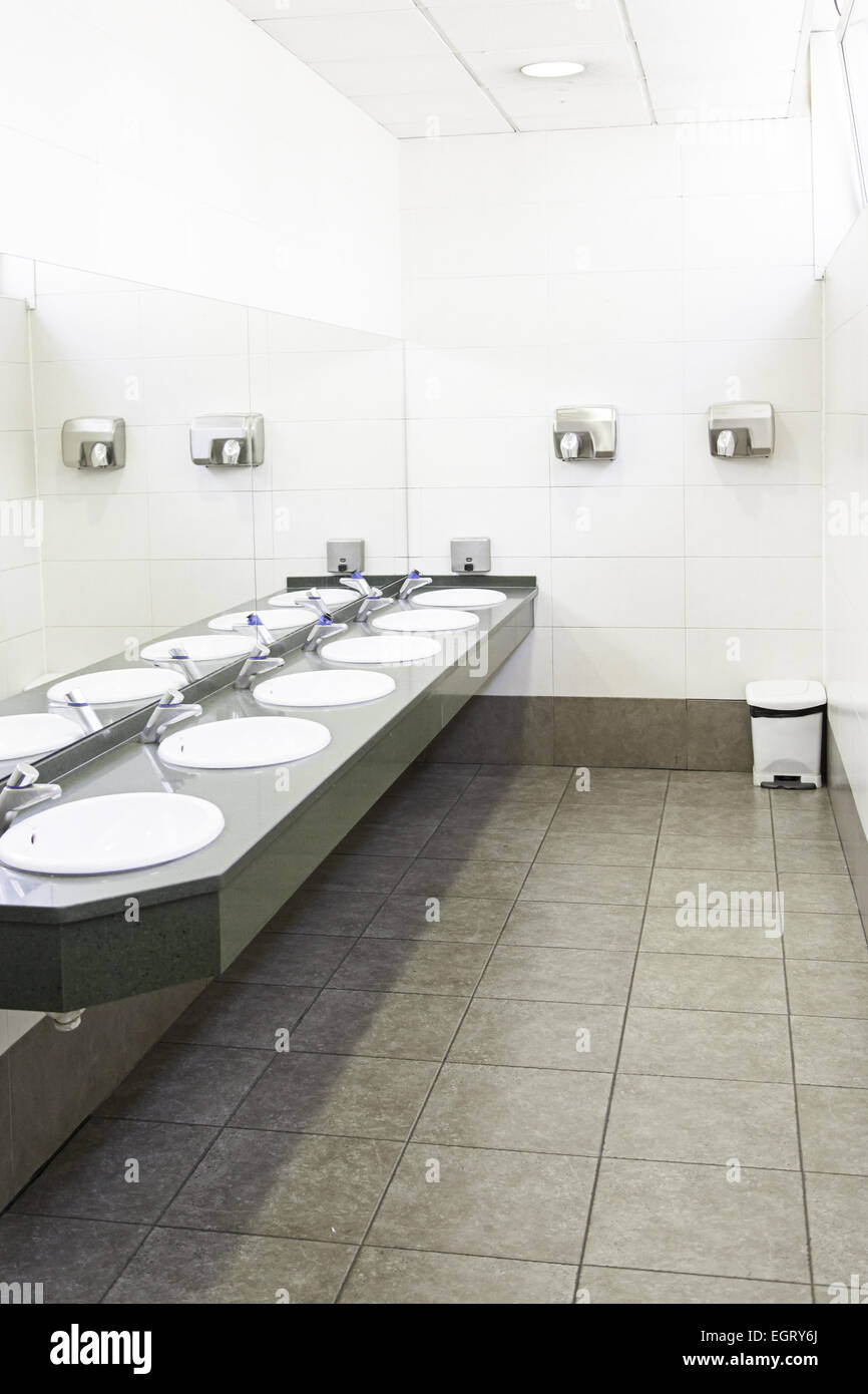 Sinks in a public toilets hi-res stock photography and images - Alamy