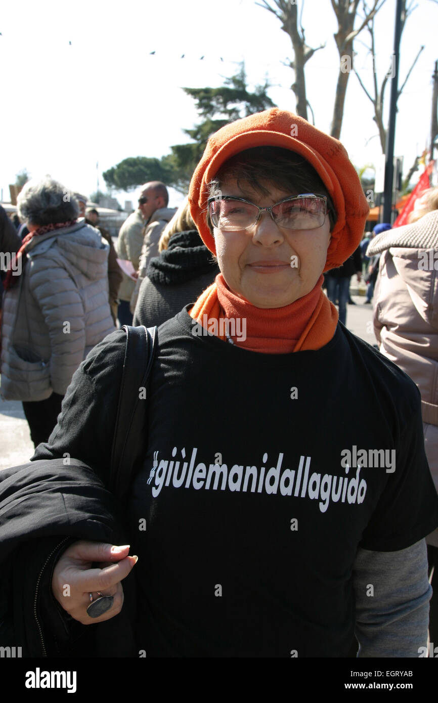 A tour guide wearing a protest printed shirt, the protest is against ...