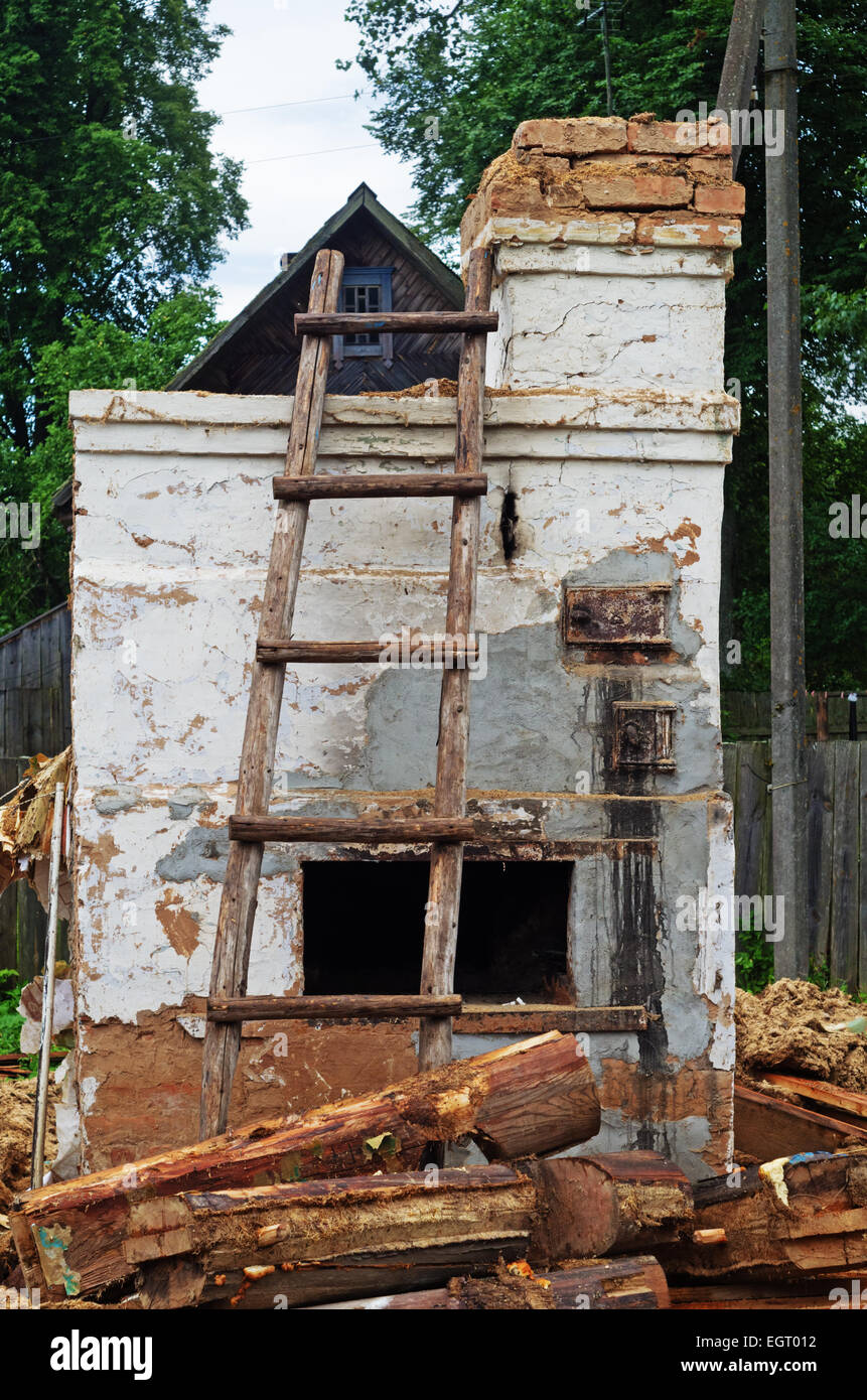 The brick stove for cooking, heating for house and with sleeping bench ...