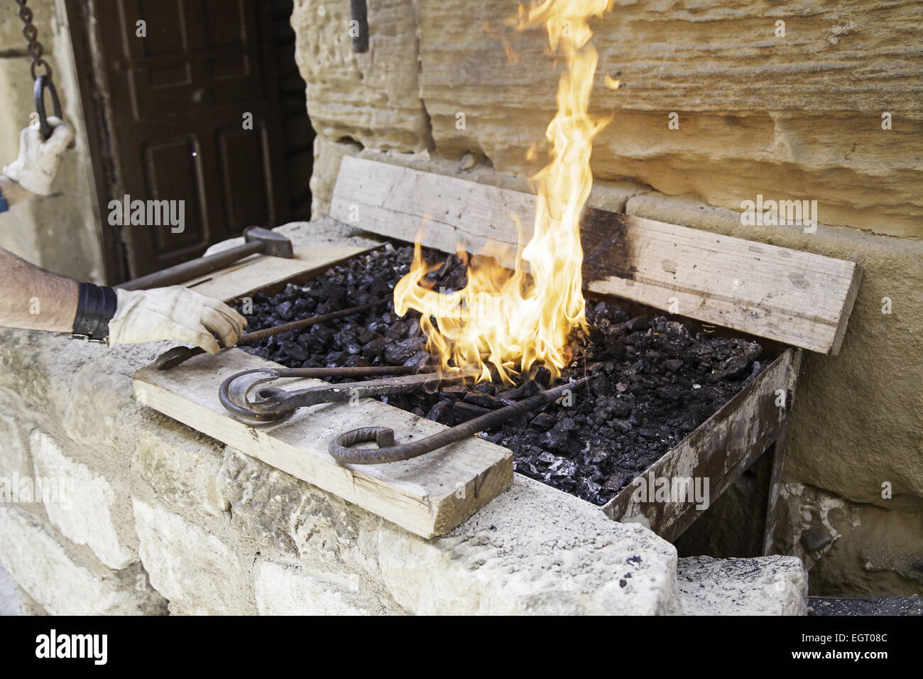 Flames in a forge, a forge detail for shaping metals, craftsmanship ...